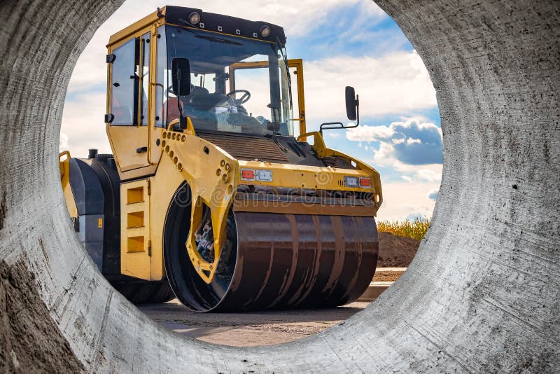 Vibratory Road Roller Lays Asphalt on a New Road Under Construction ...