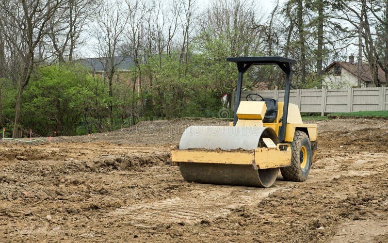 Vibratory Roller Compacting Soil at Construction Site Stock Photo ...