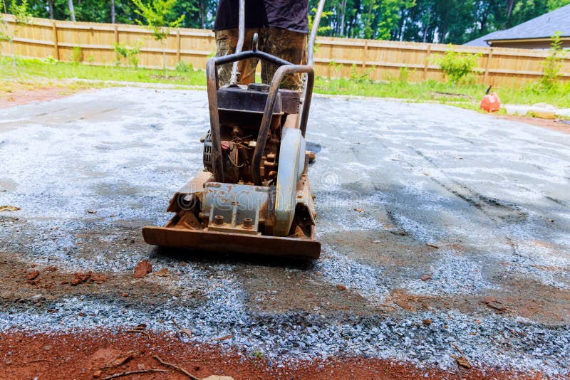 Vibratory Tamping Machine Compacting Sand during Platform Construction ...