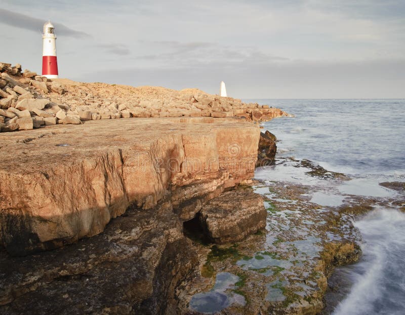 Victorian Lighthouse on Cliffs at Sunset Stock Image - Image of rocks ...