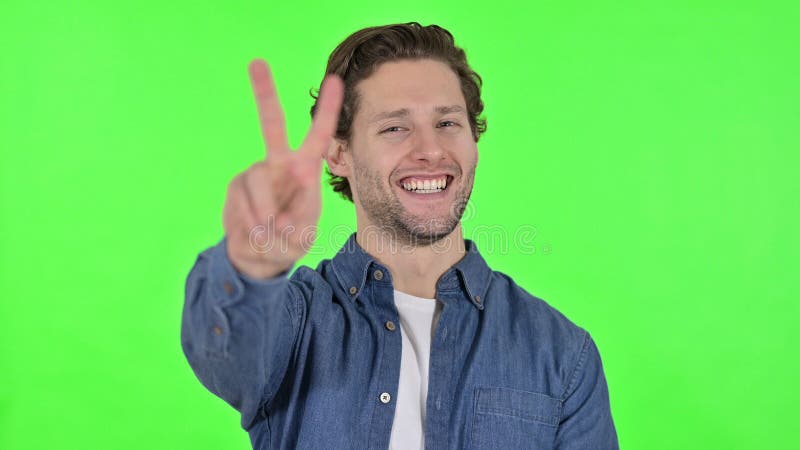 Victory Sign by Successful Young Man on Green Chroma Key Stock Image ...