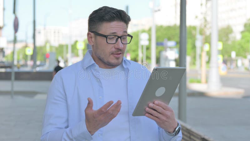 Video Call on Tablet by Man Outdoor Stock Image - Image of talking ...