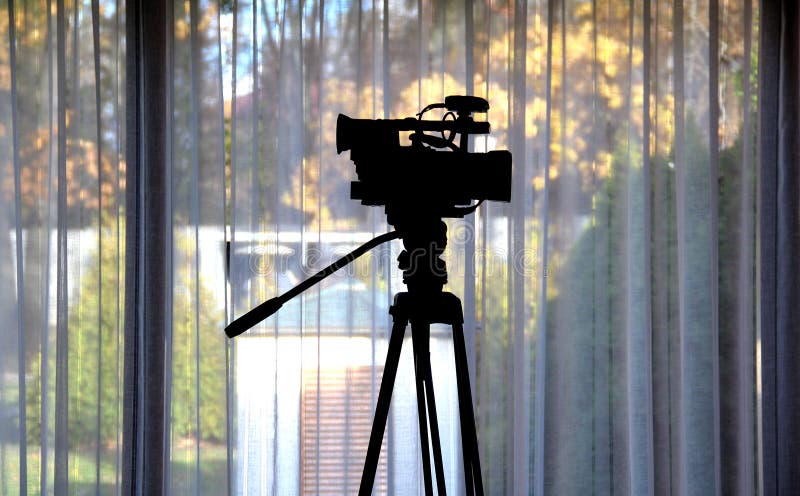 Video Camcorder on a Tripod Over Cloth Background Stock Image - Image ...