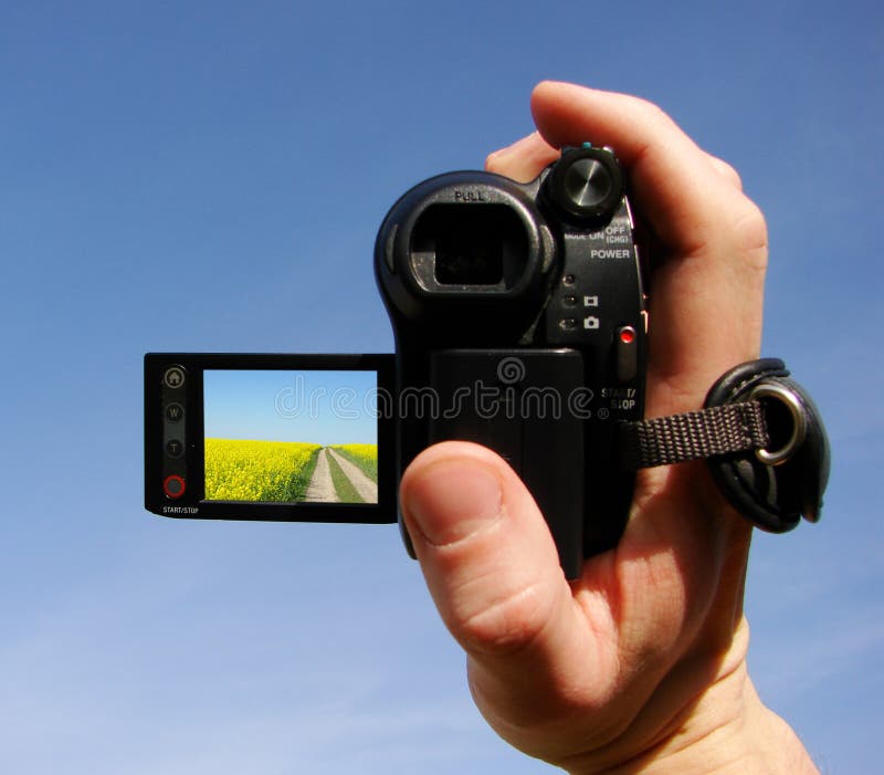 Video camera is in a hand stock image. Image of lens - 10132013