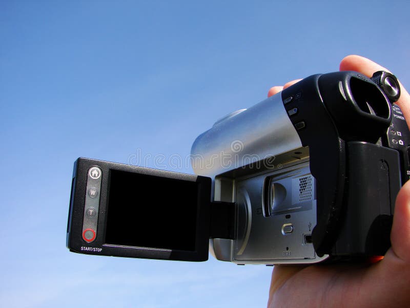 Video camera is in a hand stock image. Image of media - 9359439