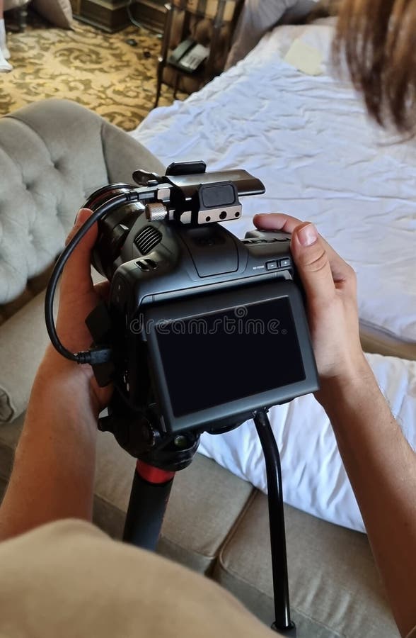 A Video Camera in the Hands of a Man. Top View. the Work of a ...