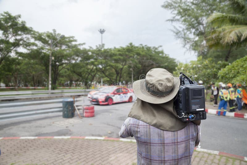 Video Cameraman Operator Racing Car in a Racetrack Stock Photo - Image ...