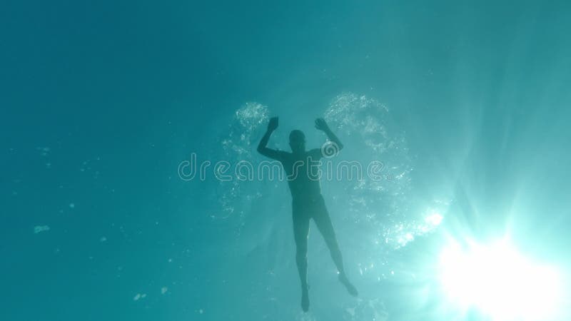 Floating in Paradise: an Underwater Video of a Man Enjoying the Sun and ...