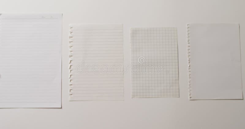 Video of Close Up of Four Sheets of Notebook Paper on White Background ...