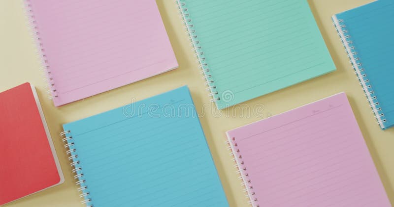 Video of Composition with Colorful Notebooks on Yellow Surface Stock ...