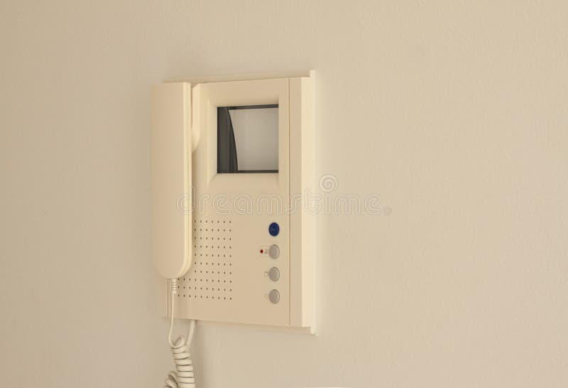 Video Door Phone with Image on CRT Display Hanging on a Wall. Hand ...