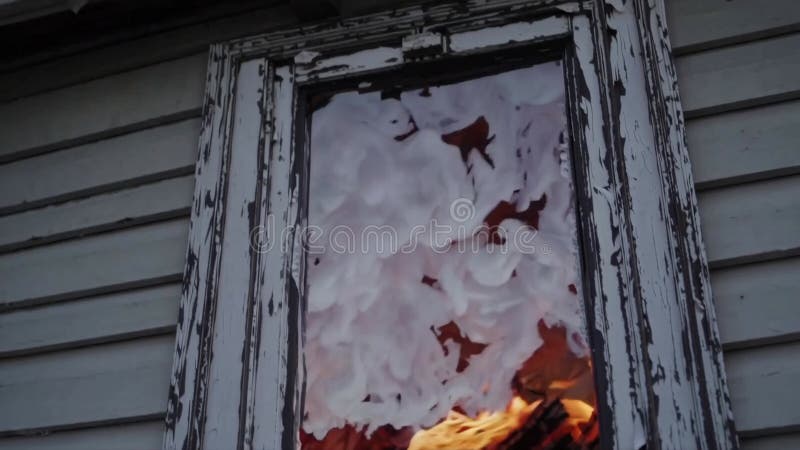 Dramatic Scene of a Broken Glass Window Glowing from the Fire within ...