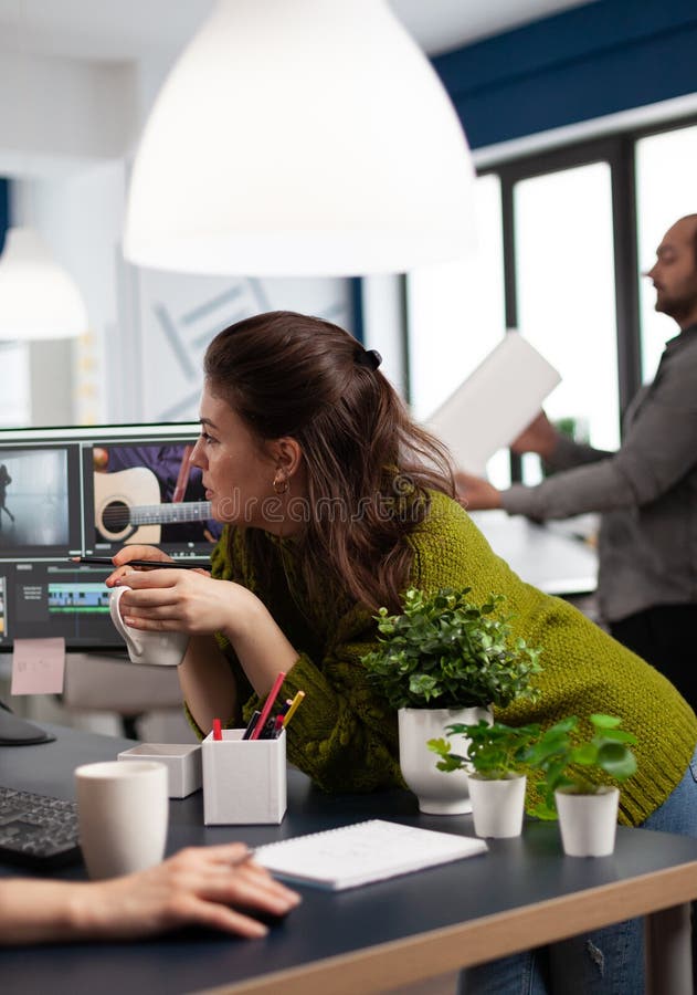 Video Editors Team Talking in Front of Pc Working at Client Creativity ...