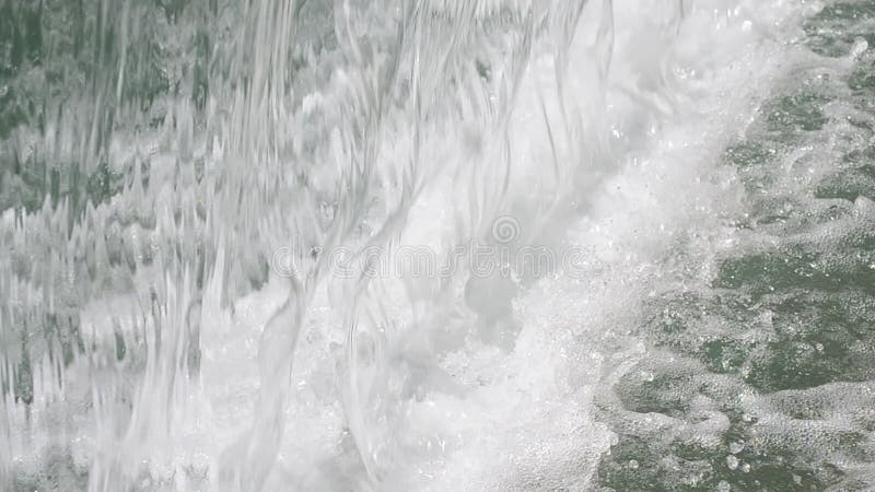 Video Falling Water Breaks into Many Splashes Creating Waves on a ...