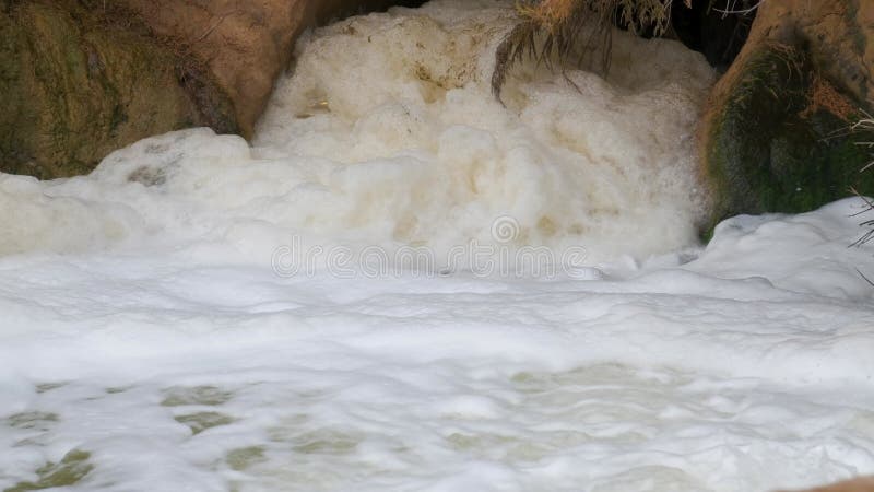 In this Video, Foam Producing a Waterfall, with Visible Dirt. Stock ...