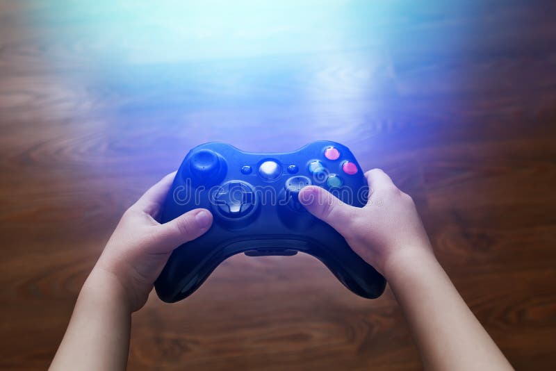 Video Game Controller in Children S Hands, in Front of the TV Stock ...