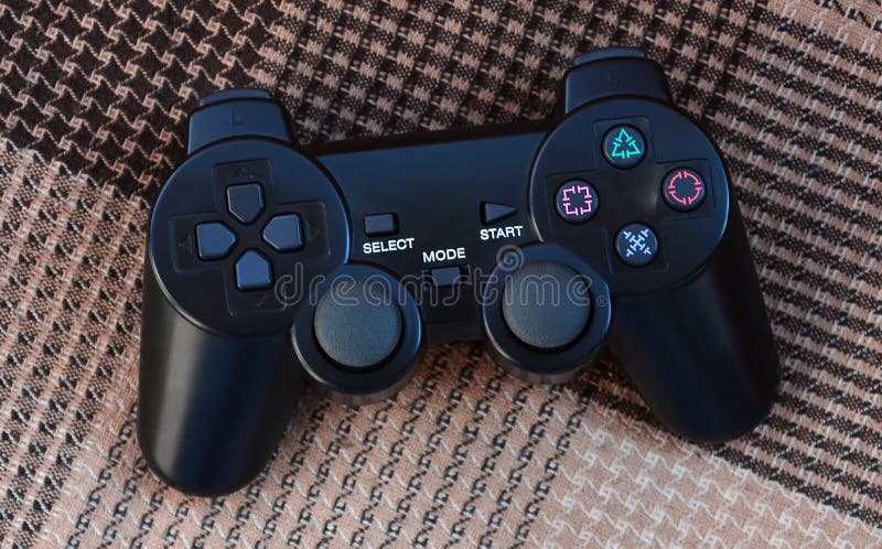 The Video Game Controller from the Game Console is on the Checkered ...