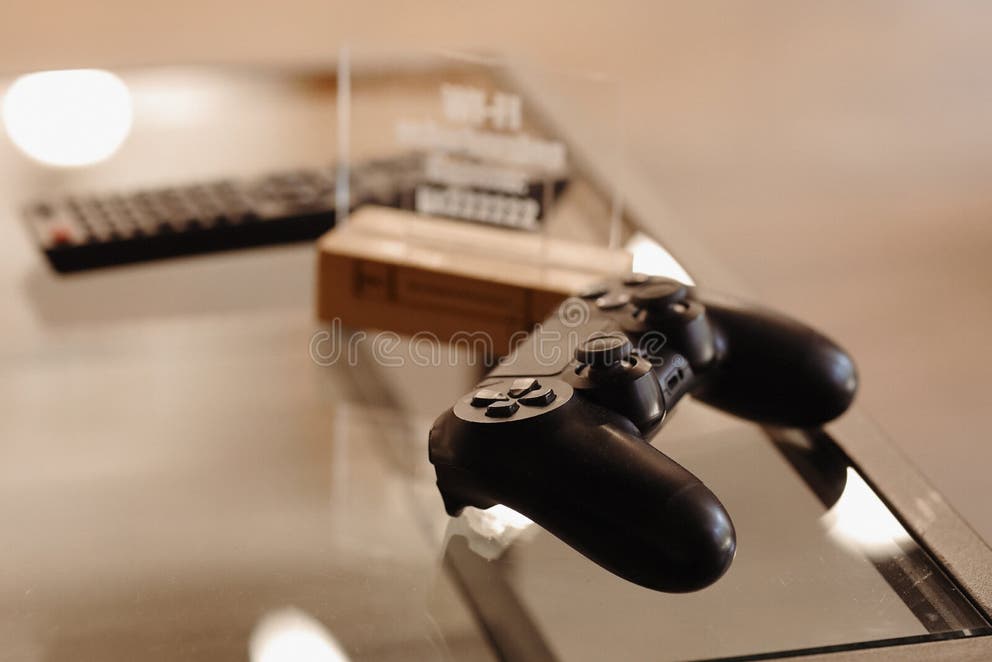 Video Game Controller on Glass Table. Gaming, Technology and ...