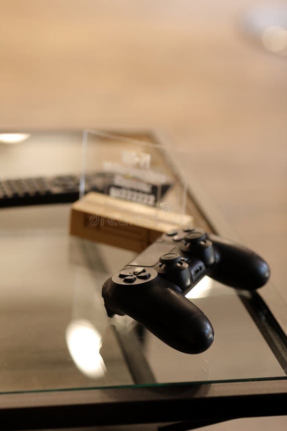 Video Game Controller on Glass Table. Gaming, Technology and ...