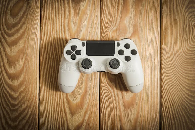 Video Game Controller on a Wooden Table Stock Image - Image of ...