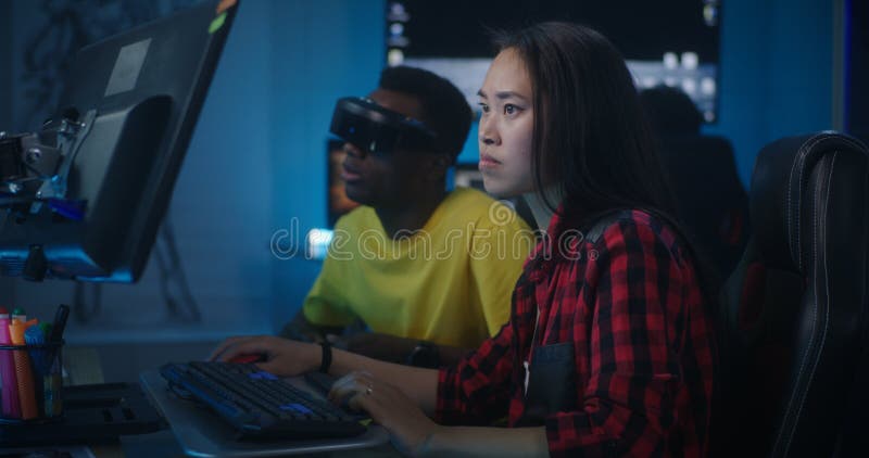 Video Game Developers Working Together Stock Photo - Image of ...