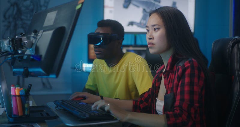 Video Game Developers Working Together Stock Image - Image of indoors ...