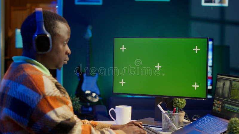 Video Maker Editing Montage Clips on Coloring Software Next To Mockup ...