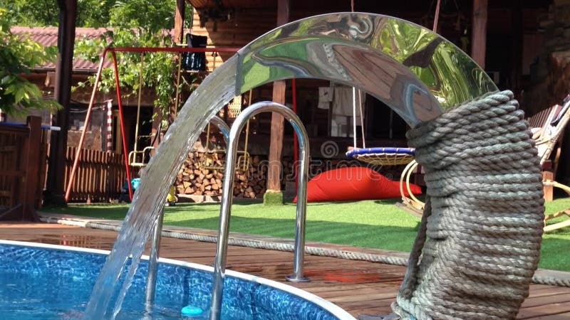 Video on Process of Turning on Artificial Waterfall in Pool in Summer ...