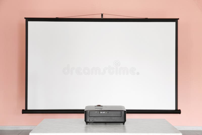 Video Projector on Table with Screen Indoors Stock Photo - Image of ...