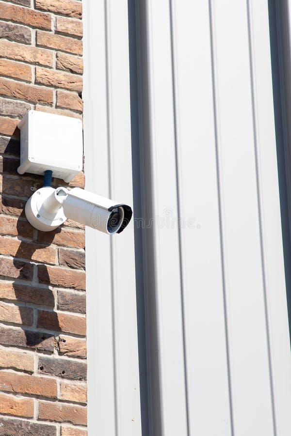 Video Security Camera Housing Mounted High in Building Stock Photo ...