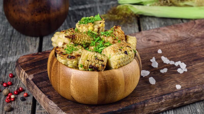 Video of Small Ears of Roasted Corn in a Wooden Bowl Stock Video ...