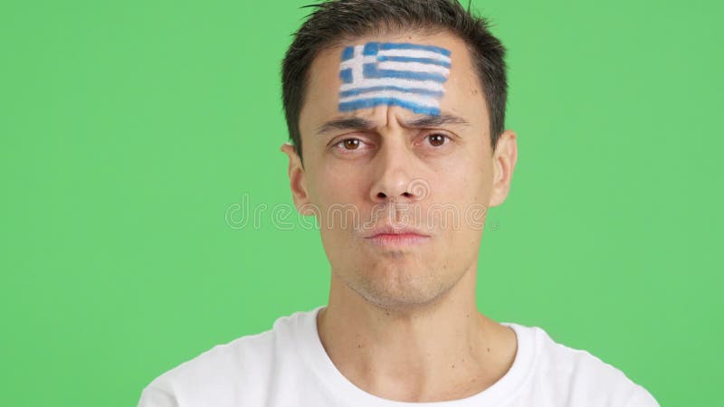 Serious Man with a Greek Flag Painted on the Face Stock Video - Video ...