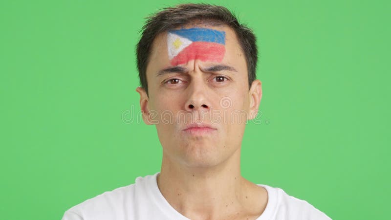 Serious Man with a Philippine Flag Painted on the Face Stock Video ...