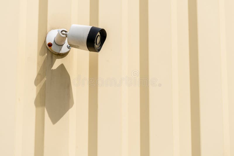 A Video Surveillance Camera is Installed on the Facade of a Building ...
