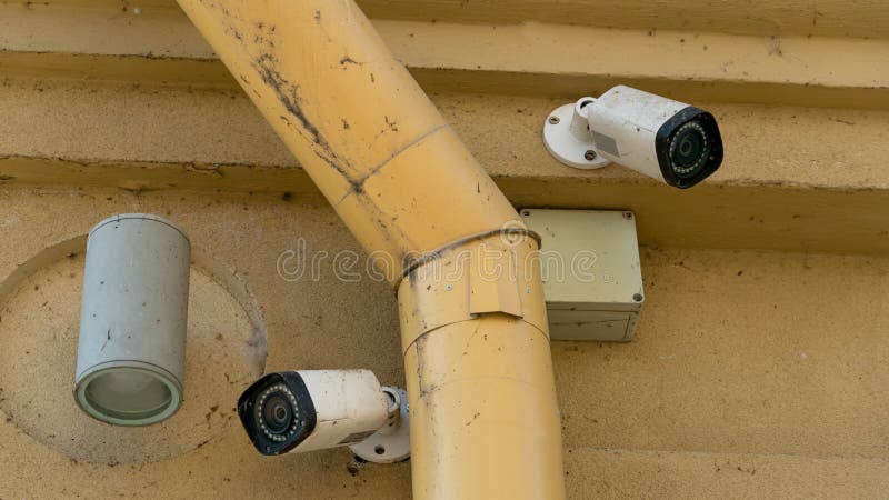 A Video Surveillance Camera is Installed on the Facade of a Building ...