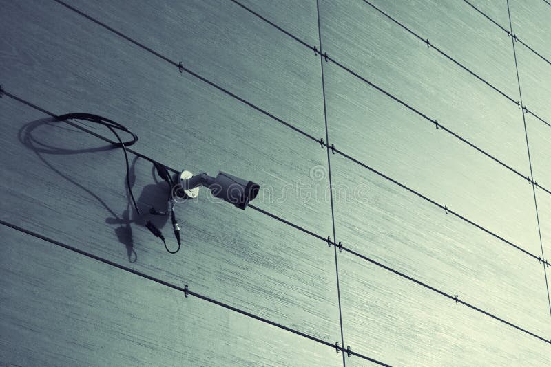 Video Surveillance Camera on a Wall of the Building Stock Photo - Image ...