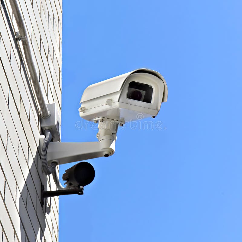 Video Surveillance Camera on a Wall of the Building Stock Image - Image ...