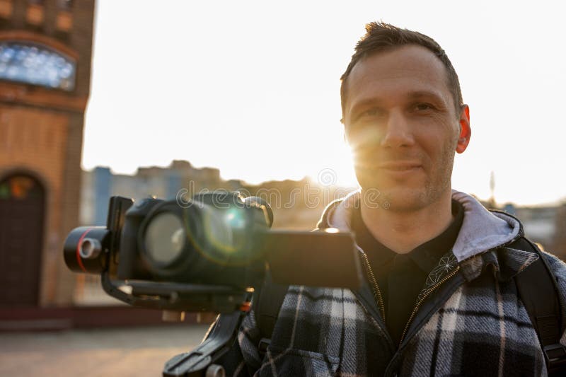 Videographer Shooting Video Using Modern Dslr Camera on 3-axis Gimbal ...