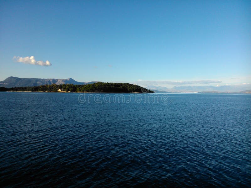 Vidos island in Corfu. stock photo. Image of clouds, greece - 46055154