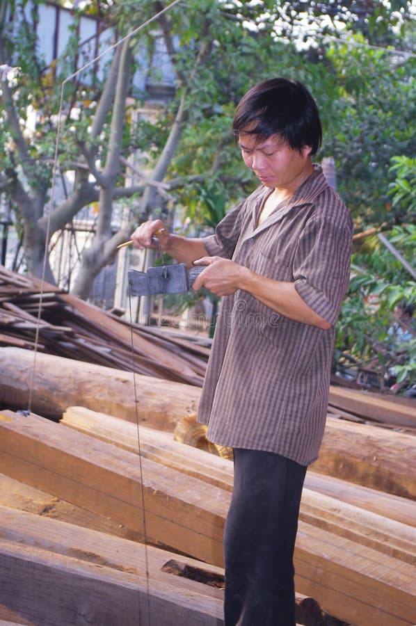 Vietnamese carpenter editorial image. Image of reel, temple - 23846450