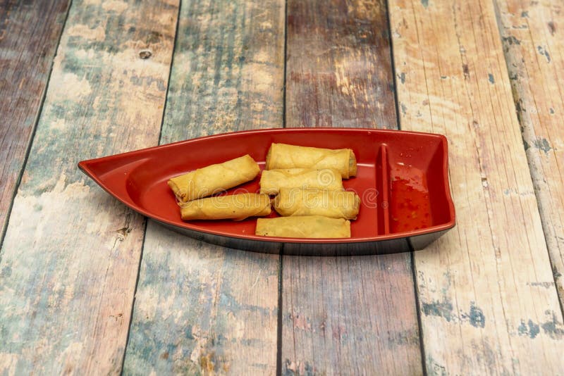 Vietnamese Spring Rolls on a Boat-shaped Plate with Dipping Sauce Stock ...