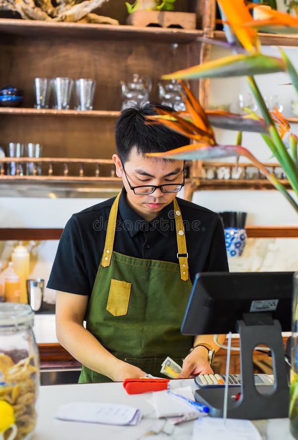 Vietnamese Waiter Working in Counter with Cashier Machine in a Cafe ...