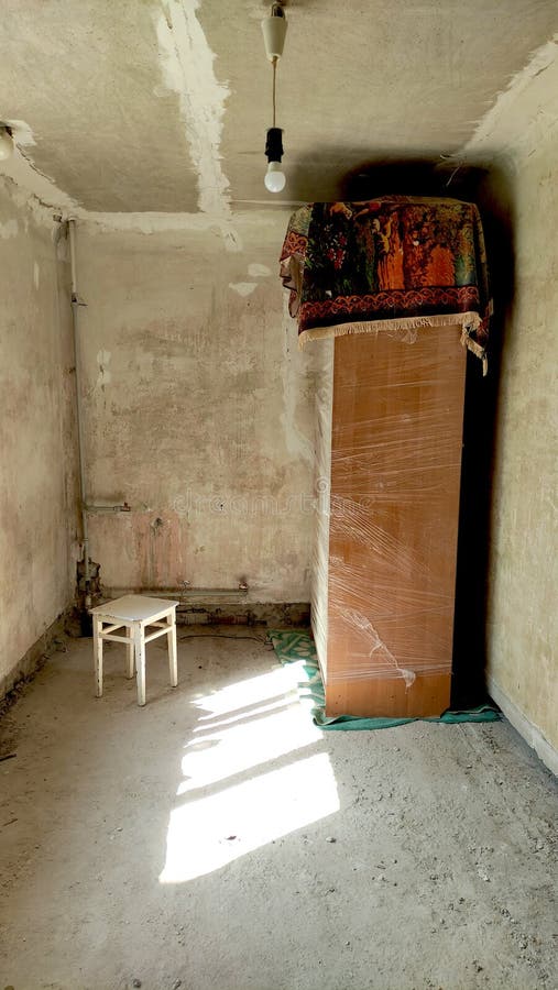 View of an Abandoned Empty Room with a Wardrobe and a Stool Stock Photo ...