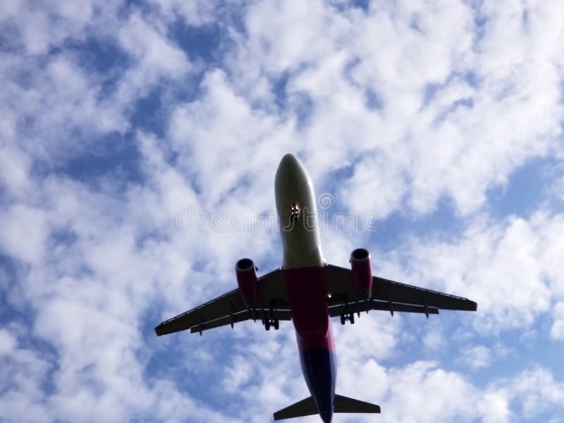 View from Above on Airplane in Flight. Aircraft is Flying in Blue ...