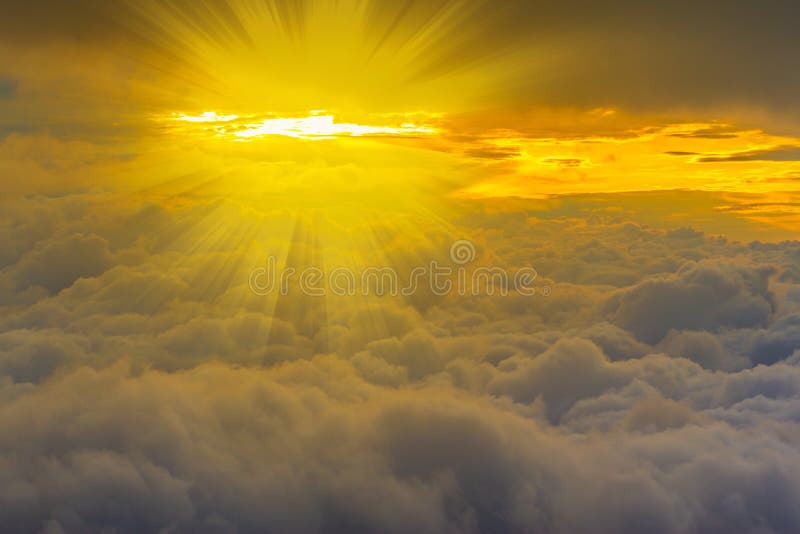 View Above the Clouds and Yellow Light Beams Stock Photo - Image of ...