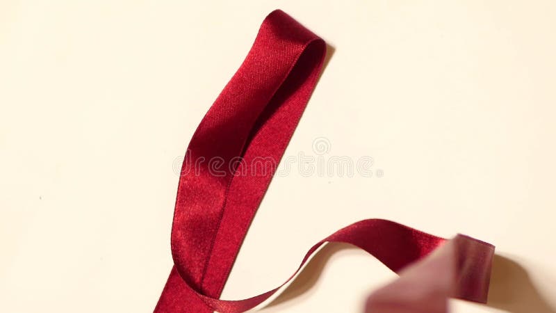 Red Ribbon Falling on White Background. Stock Footage - Video of ...