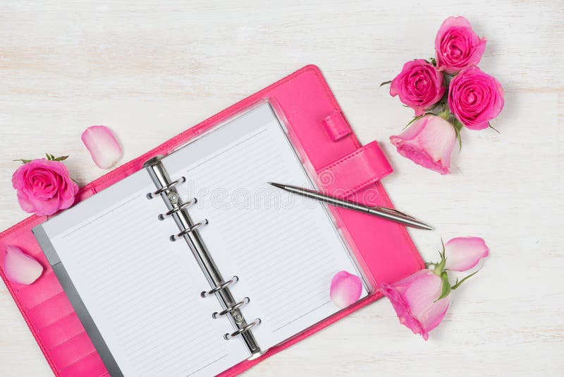 View from Above with Pink Flowers and Notebook. White Wooden Tab Stock ...