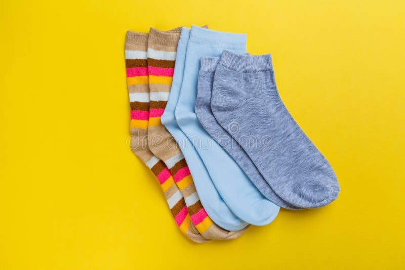 View from Above. Socks are Scattered on a Yellow Background. Clothing ...