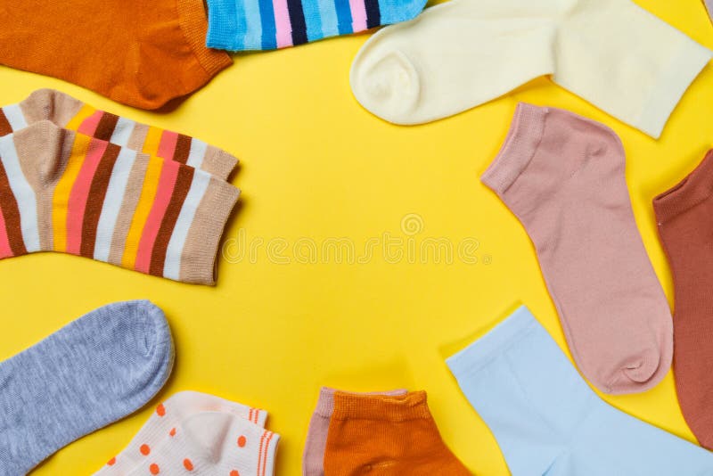 View from Above. Socks are Scattered on a Yellow Background. Clothing ...