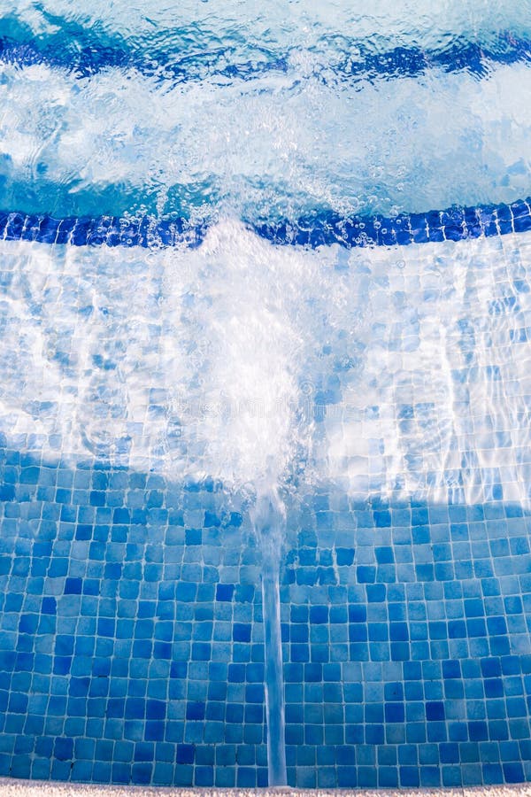 View from Above of a Water Jet Filling a Pool in Summer and Creating ...